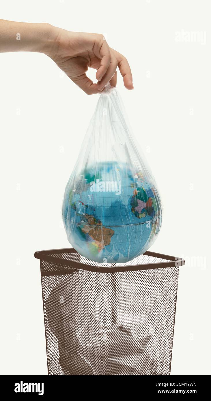 Surreal collage art. Hand holding globe in plastic bag above trash bin ...