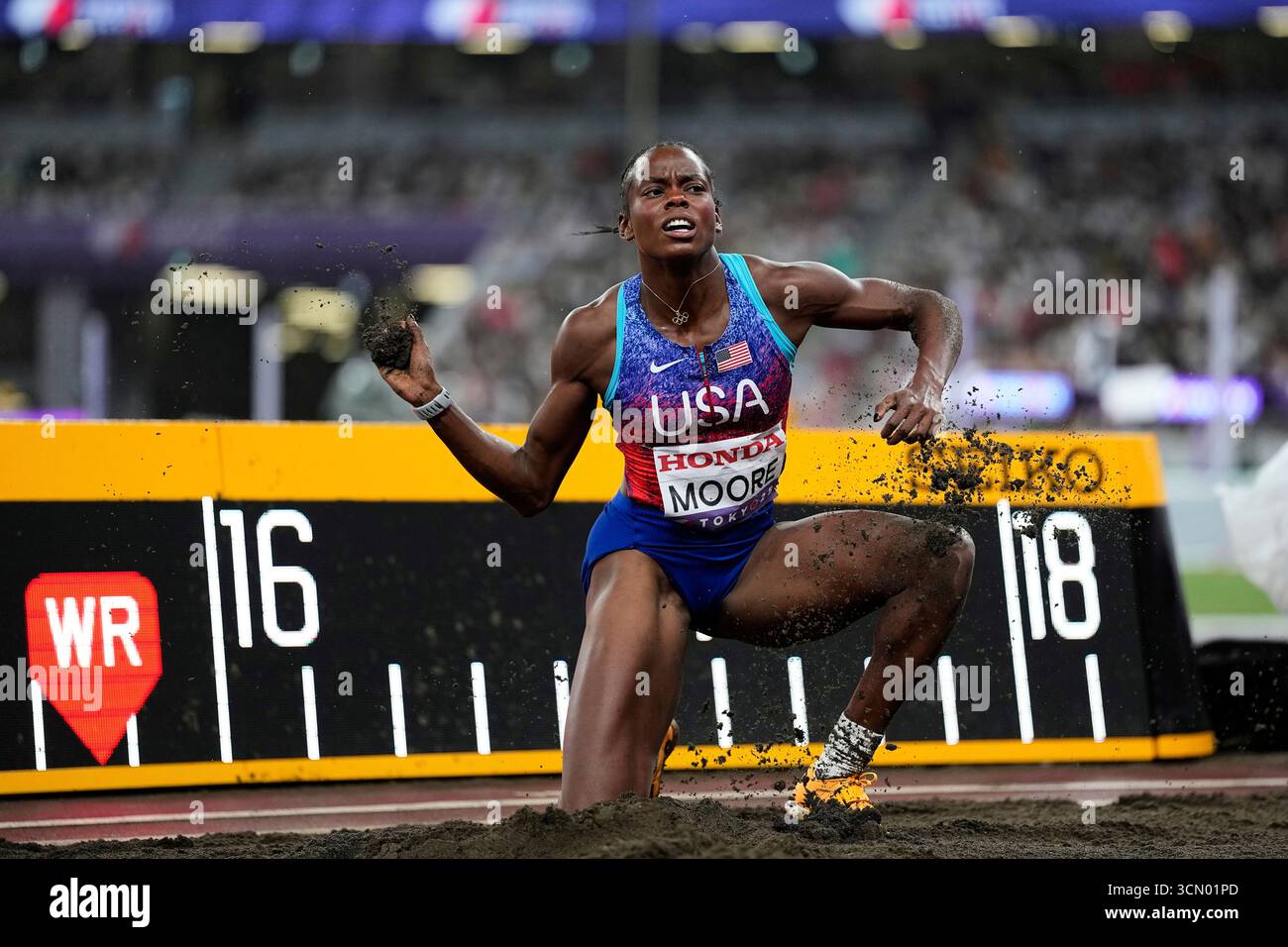 United States' Jasmine Moore makes an attempt in the women's triple ...