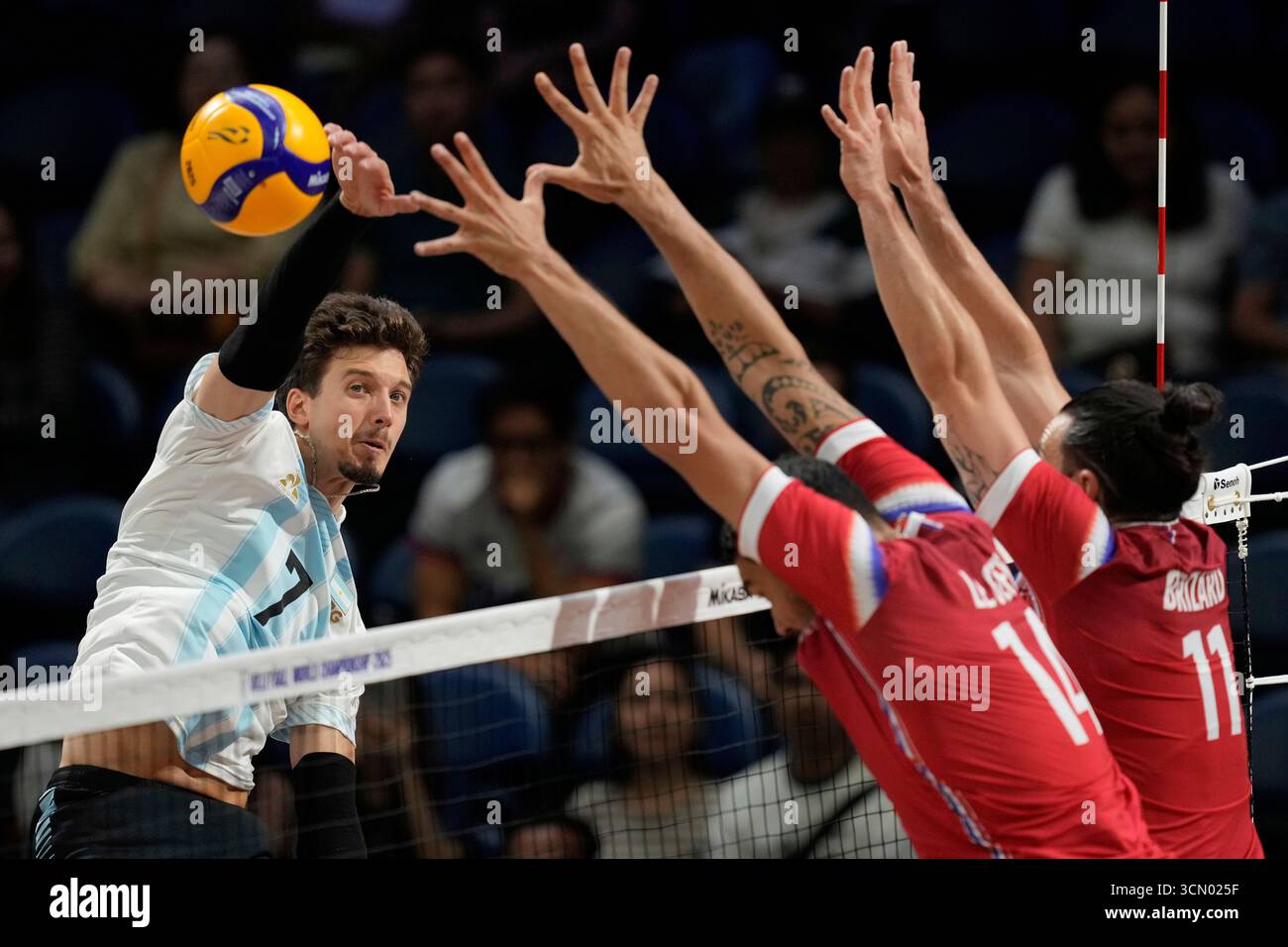 Luciano Palonsky, left, of Argentina hits the ball against France ...