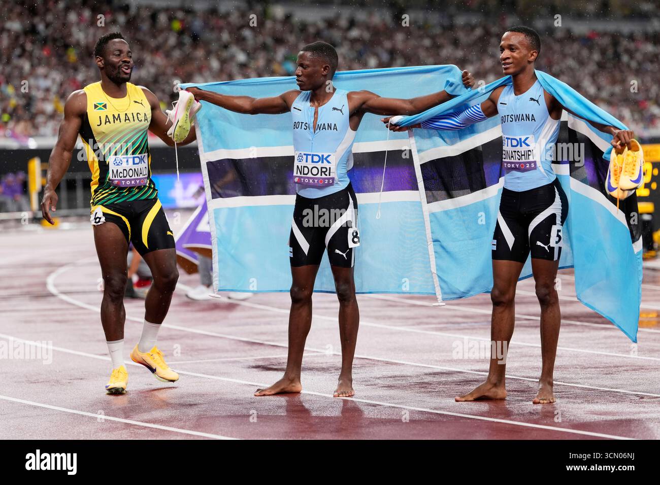 Gold medalist Botswana's Busang Collen Kebinatshipi, right, celebrates ...