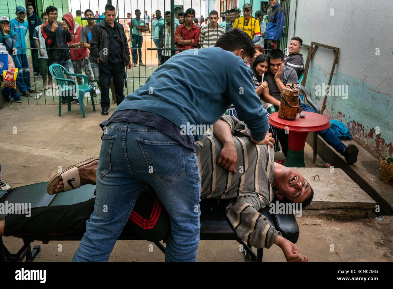 FILE PHOTO GALLERY - An inmate giggles as a volunteer physical ...