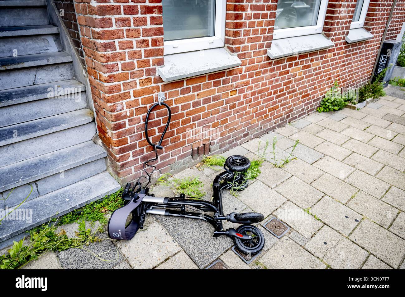 THE HAGUE - A walker with a bicycle lock on the wall ANP /HOLLANDSE ...