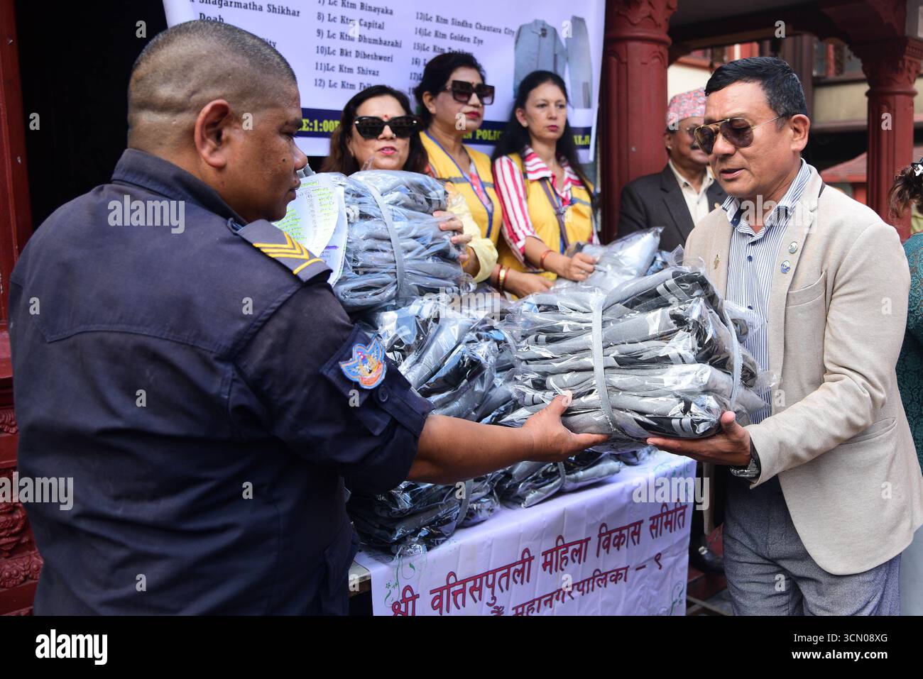 Kathmandu, Nepal. 18 September, 2025. A Nepal Police officer is handed ...