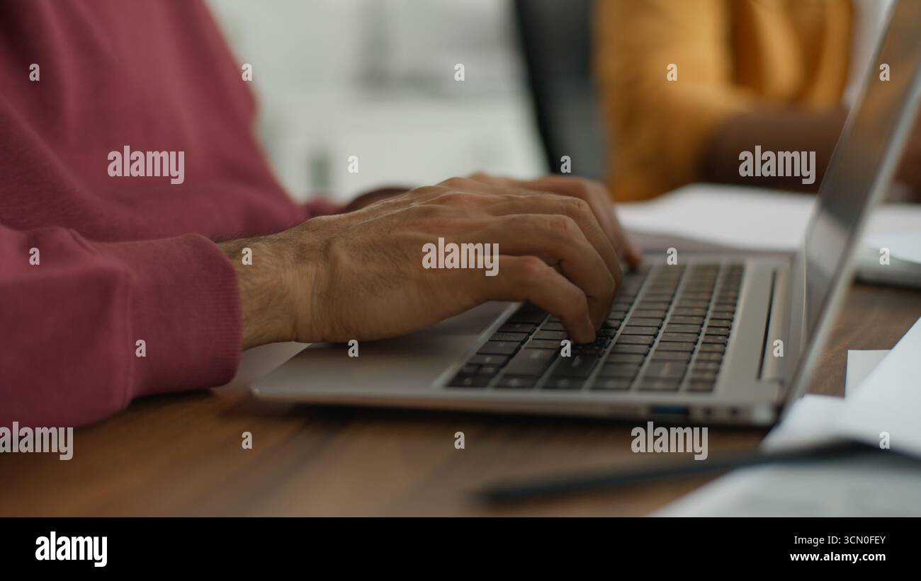 Close up unrecognizable business man typing laptop working computer ...