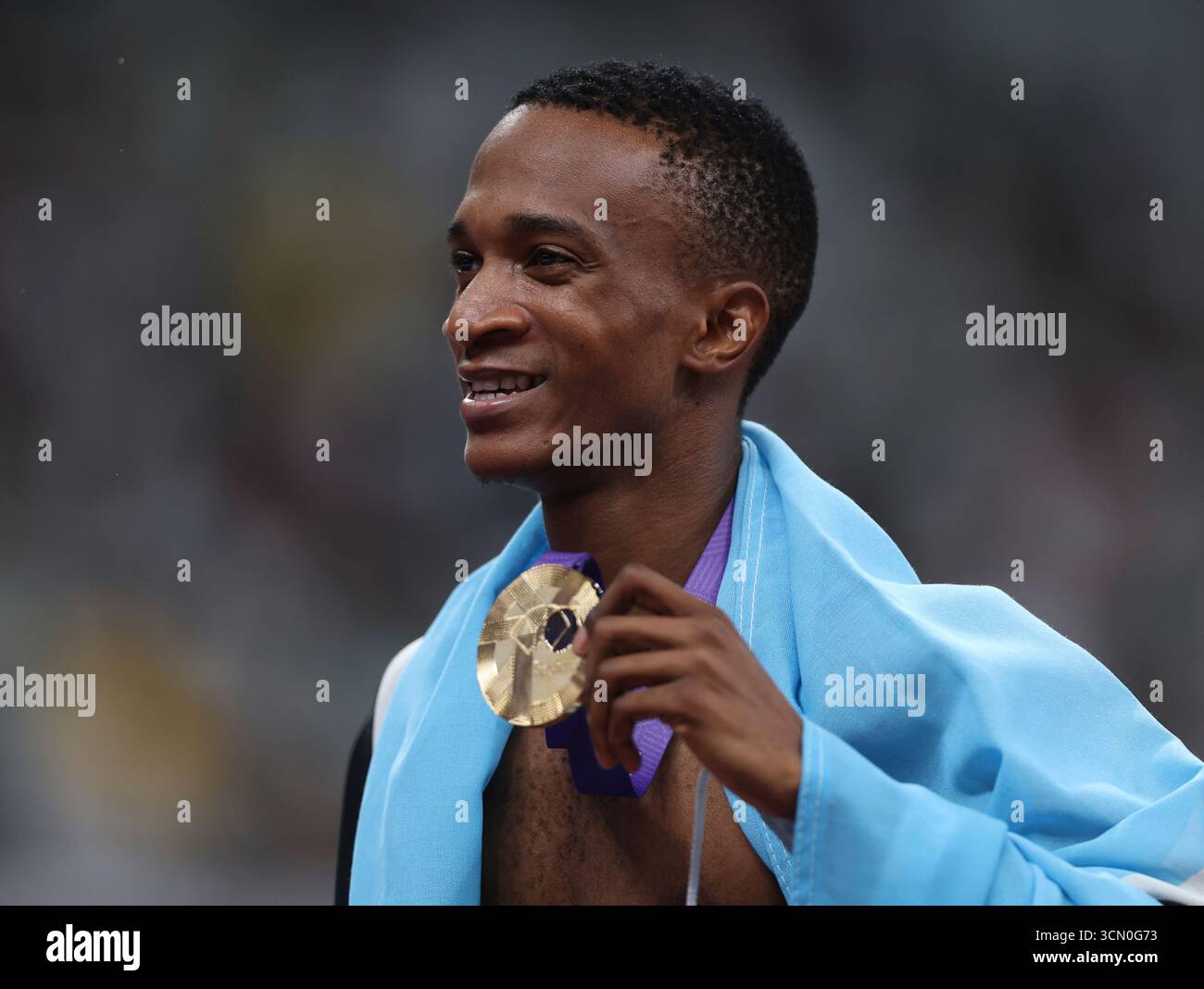 Busang Collen KEBINATSHIPI of BOTSWANA poses for his gold medal of the ...