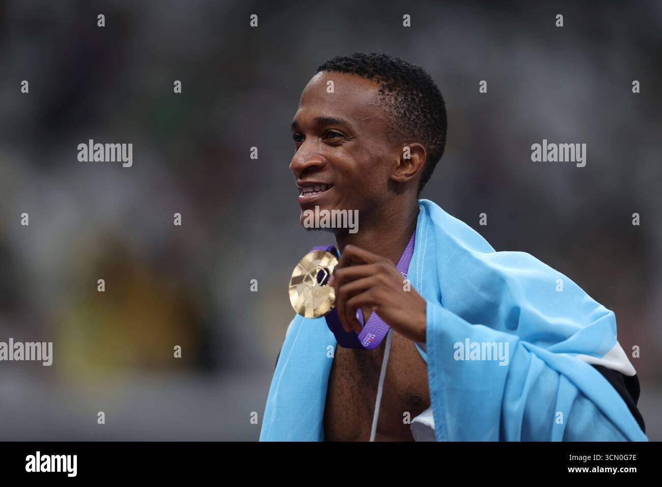 Busang Collen KEBINATSHIPI of BOTSWANA poses for his gold medal of the ...