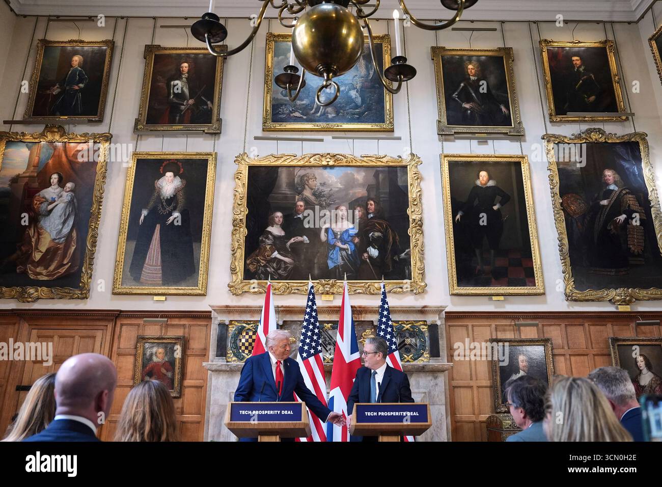 President Donald Trump reaches to Britain's Prime Minister Keir Starmer ...