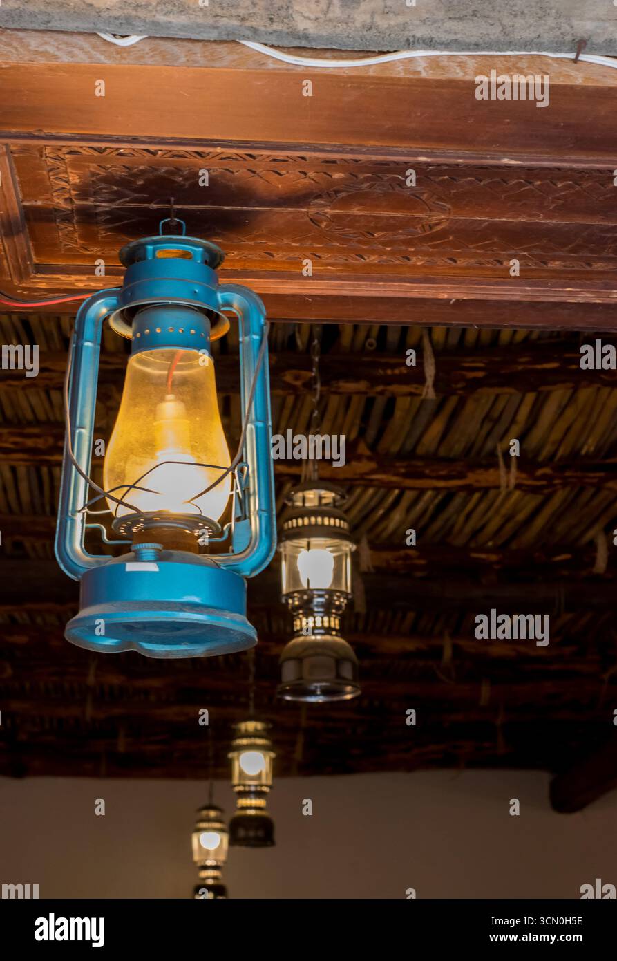 A picture of old lamps hanging for lighting in one of the historic ...