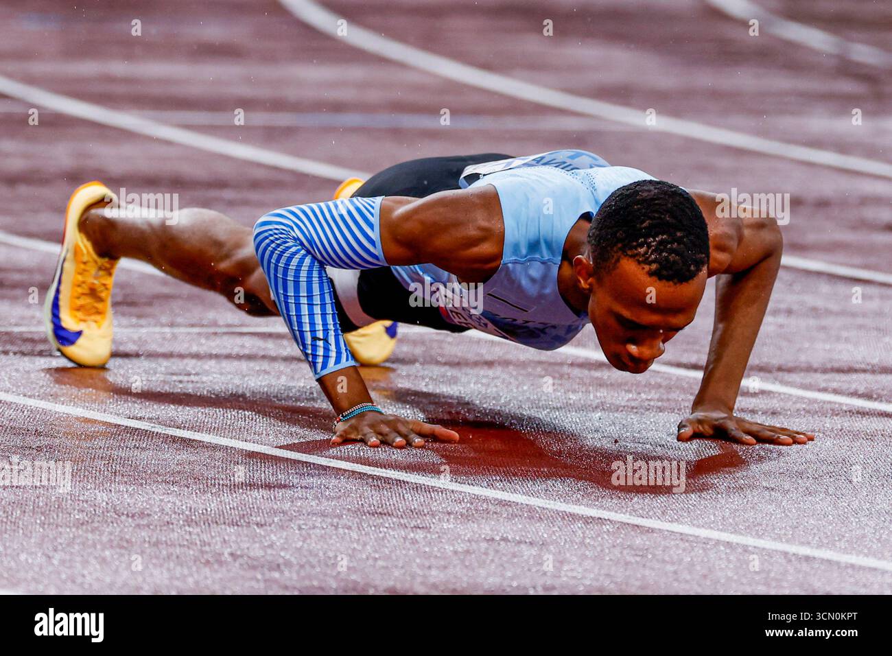 winner Busang Collen Kebinatshipi of Botswana doing push ups as ...