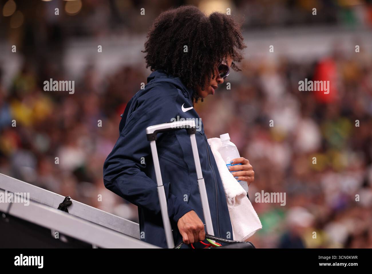 Vashti Cunningham (USA) leaves with her suitcase during the World ...