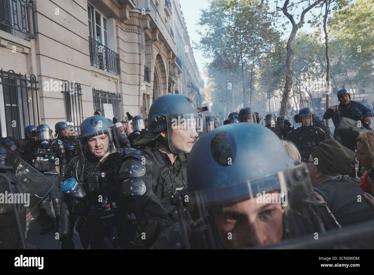 Police officers face protesters during a demonstration called by major ...