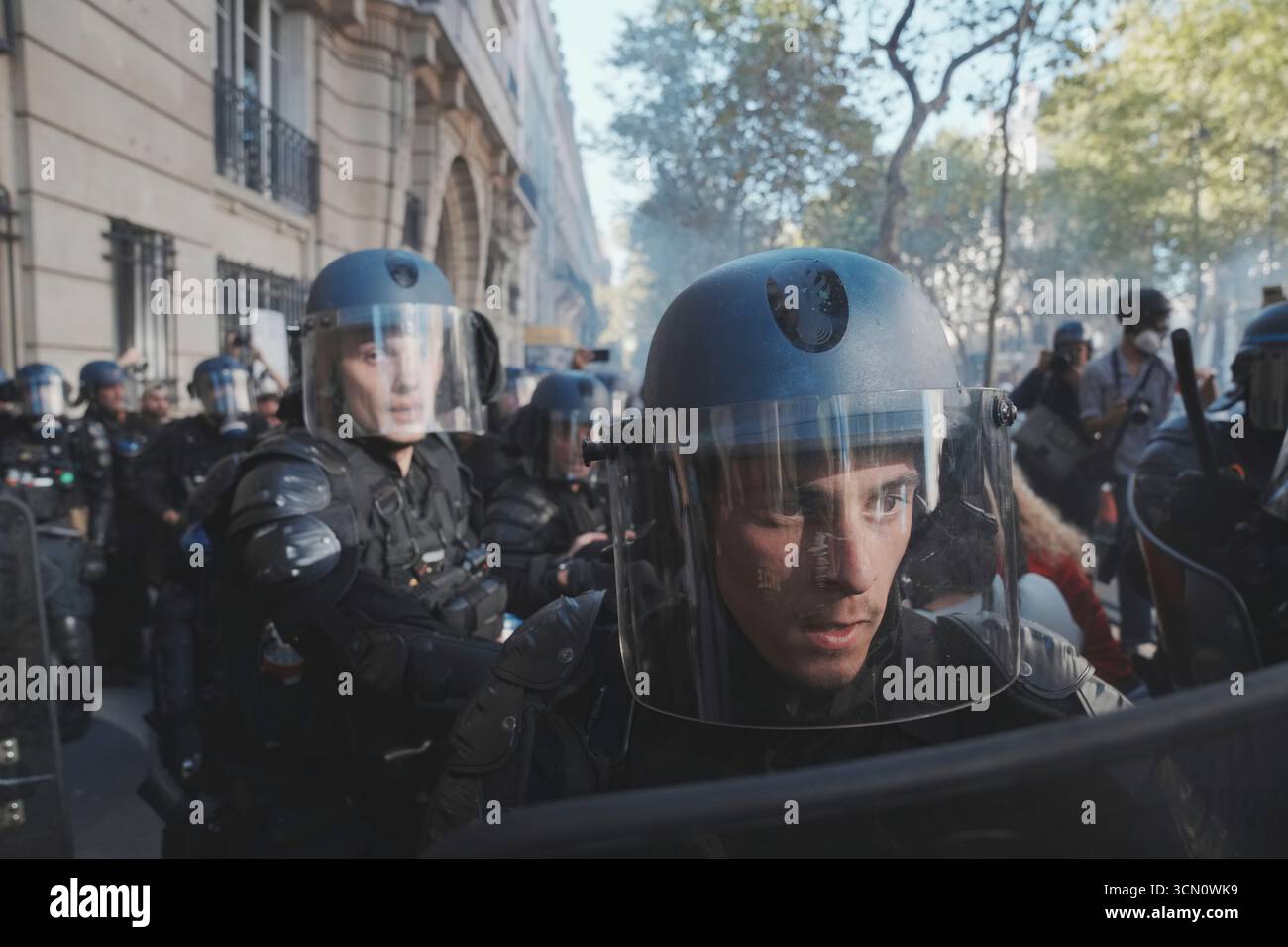 Police officers face protesters during a demonstration called by major ...