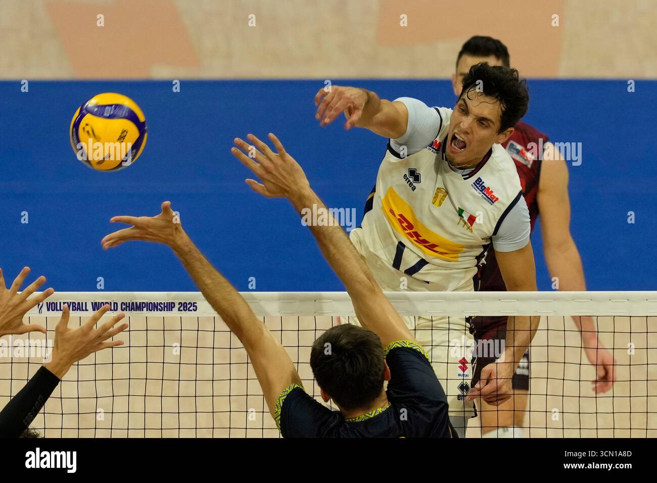 Mattia Bottolo of Italy spikes the ball against during their pool phase match at the 2025 FIVB ...