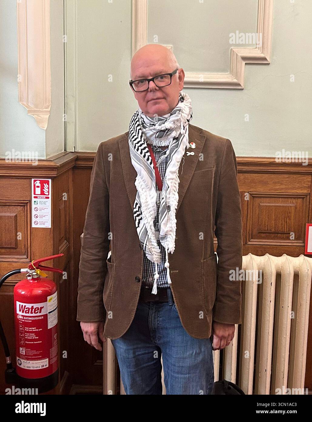 Green Party Councillor Stuart Jeffery poses for a photo wearing a ...
