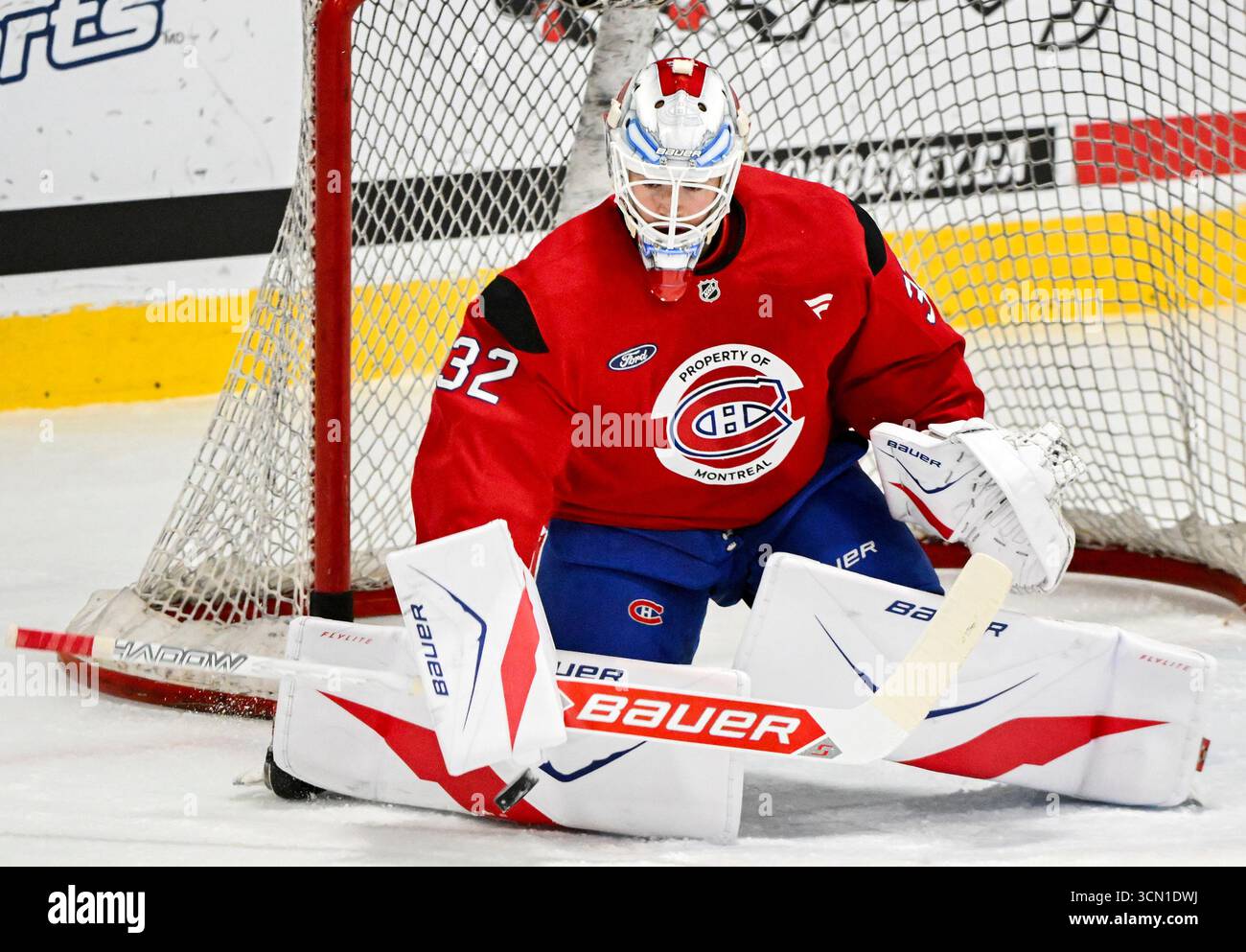 Montreal Canadiens goaltender Jacob Fowler makes a save during ...
