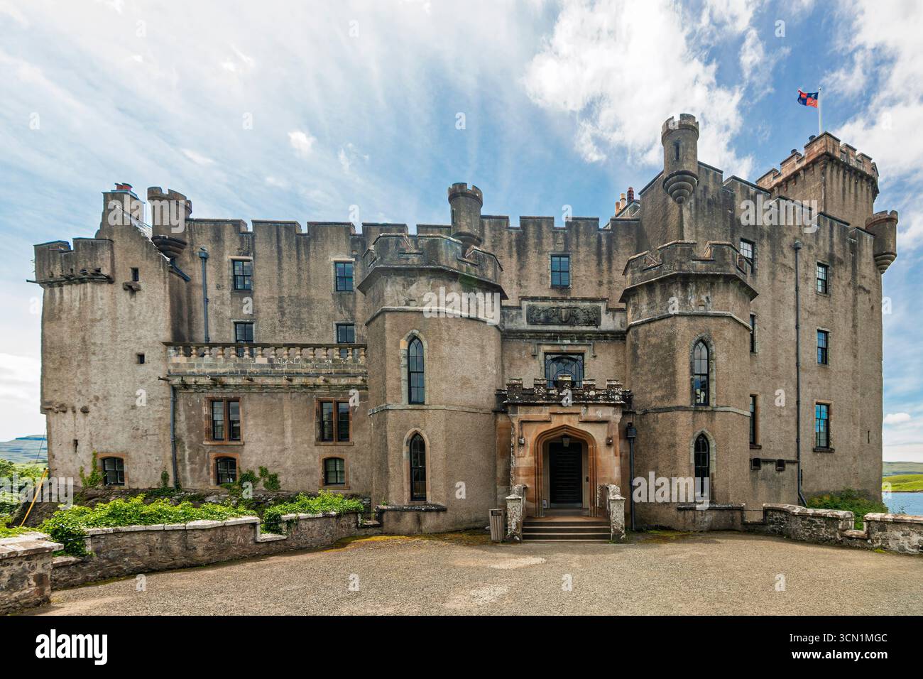Silver daylight washes Dunvegan Castle on Skye, Scotland, its stone ...
