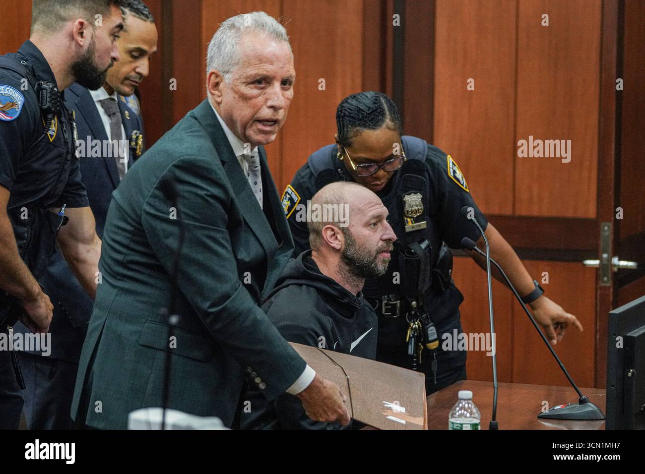 Jeremy Fistel, right, sits at the defense table with his attorney Todd ...