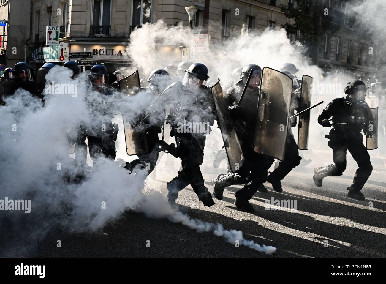 Clashes occur between French riot police and protesters during a ...