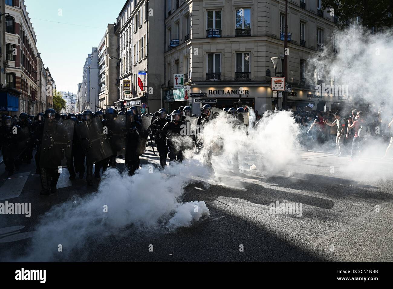 Clashes occur between French riot police and protesters during a ...