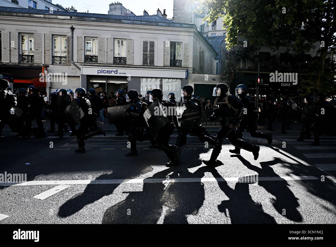 Clashes occur between French riot police and protesters during a ...