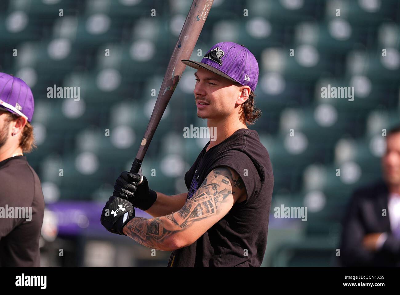 Colorado Rockies left fielder Jordan Beck (27) warms up before a ...