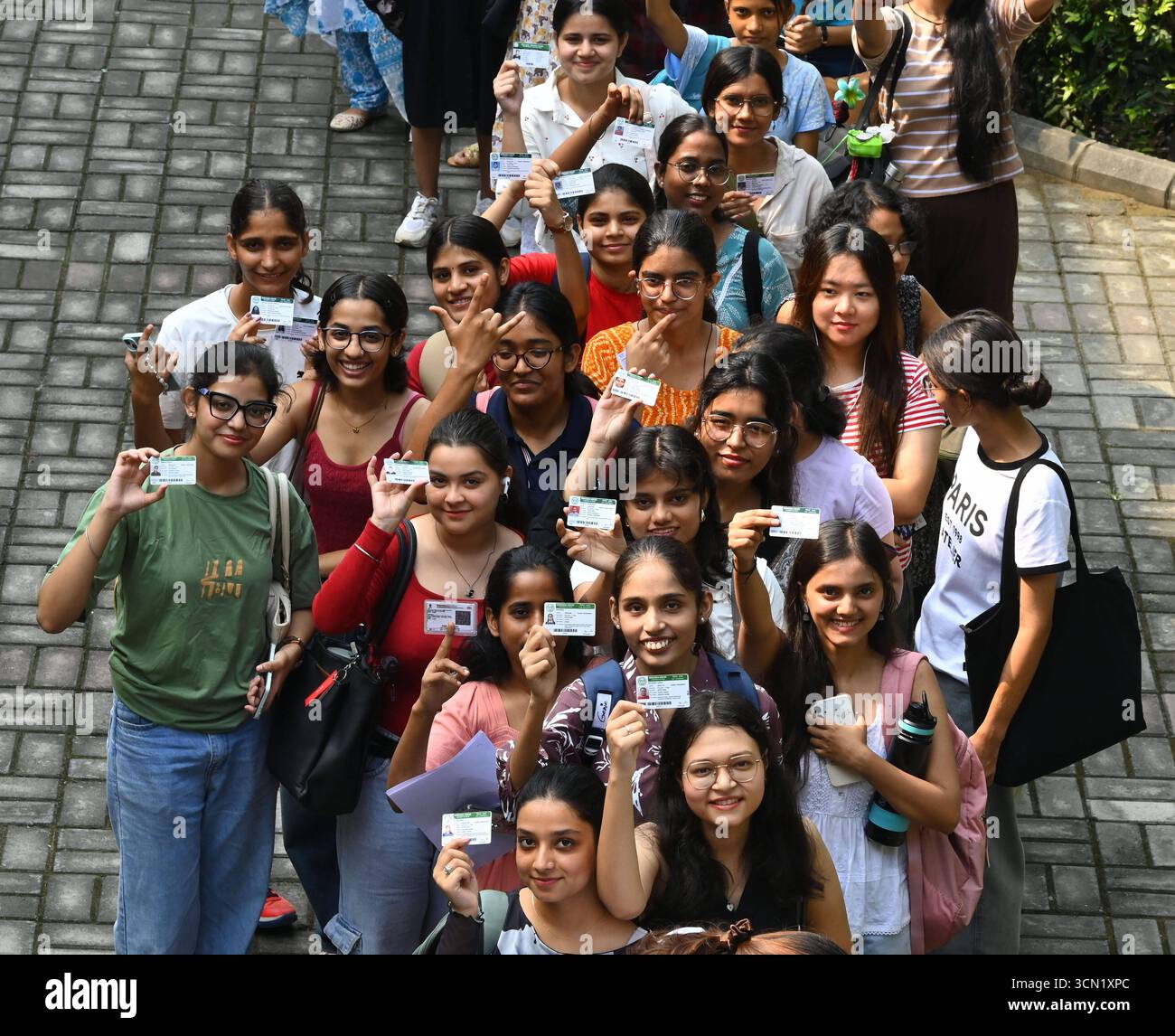 NEW DELHI, INDIA - SEPTEMBER 18: Students line up to cast their votes ...