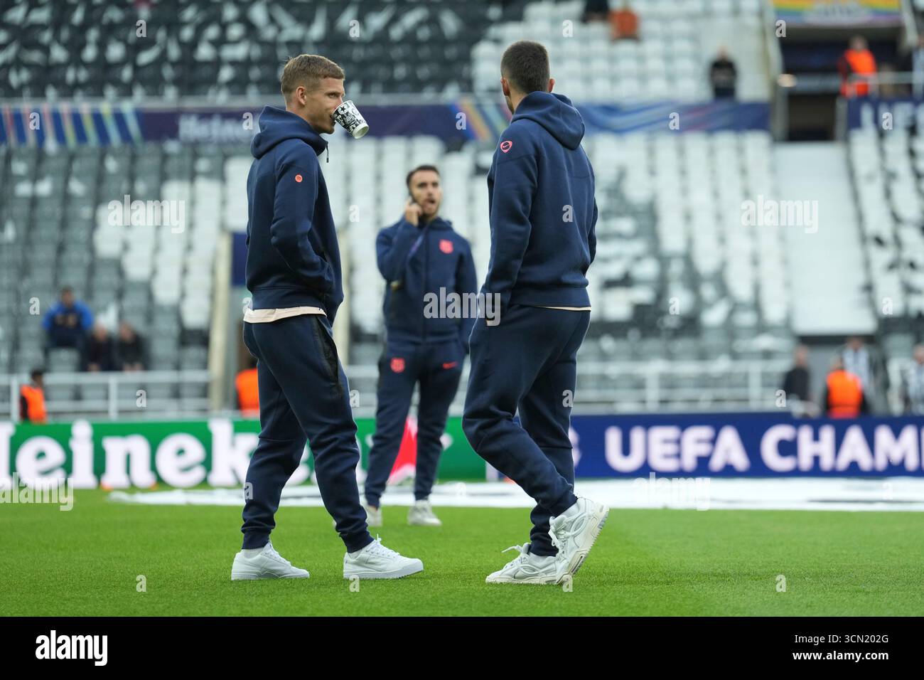 Barcelona's Dani Olmo, left, bites a cup prior the start of the the ...