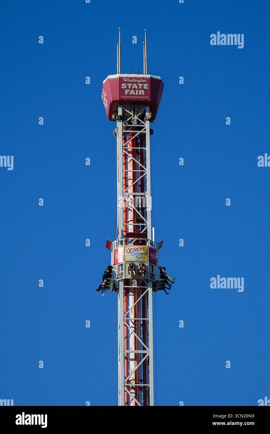 Fair attendees ride the Extreme Scream tower launch ride at the 125th ...