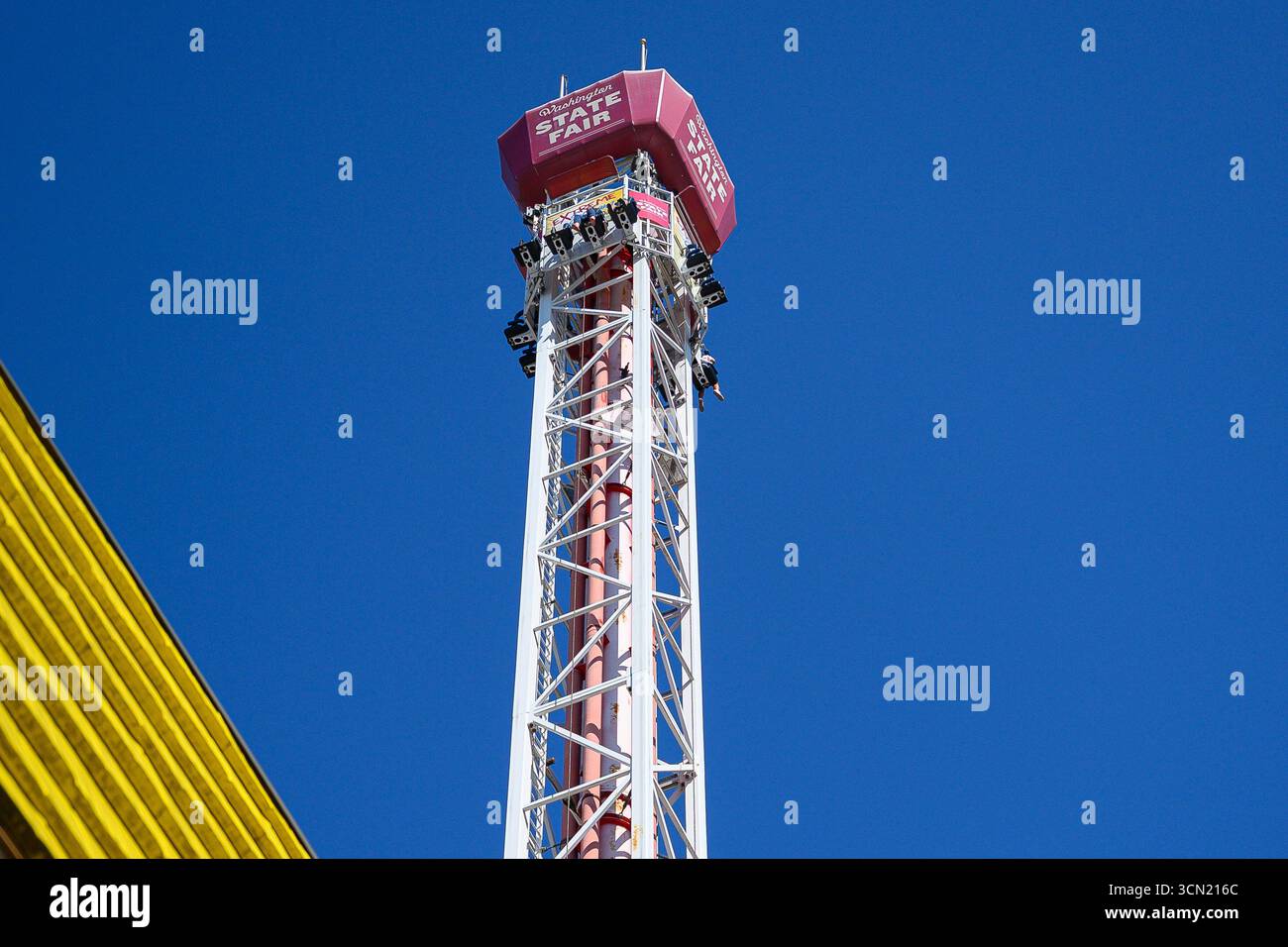Fair attendees ride the Extreme Scream tower launch ride at the 125th ...
