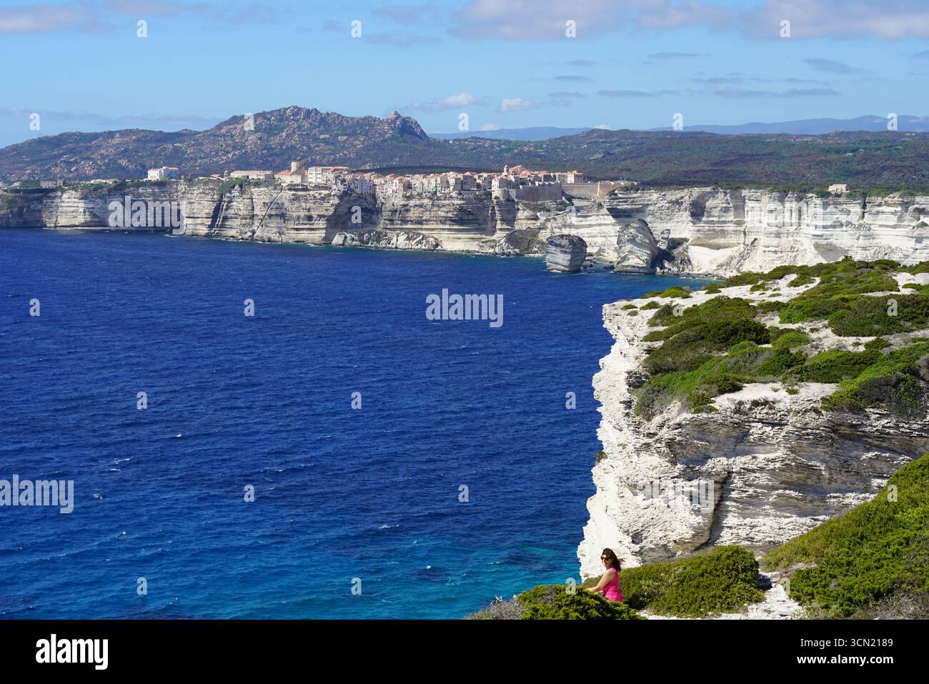 Scenic Coastal Cliffs Over Deep Blue Sea With Seaside Village In ...