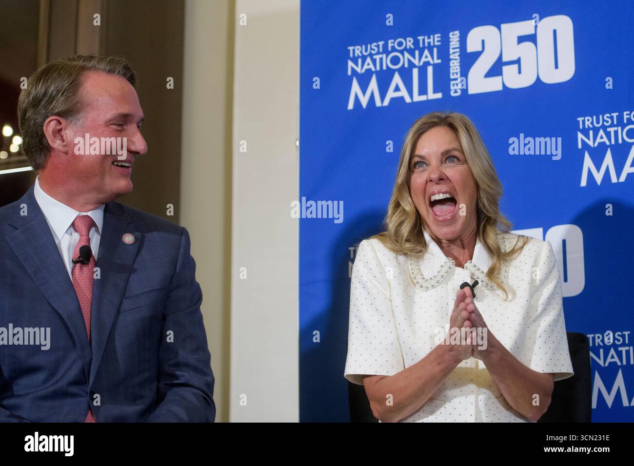 Virginia Gov. Glenn Youngkin, left, looks on as his wife, first lady of Virginia Suzanne S ...