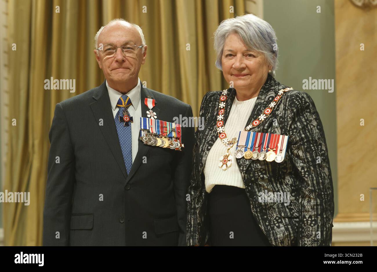 Former Chief of the Defence Staff Raymond Henault is invested as a ...