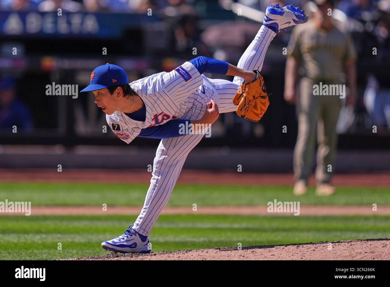 New York Mets pitcher Jonah Tong follows through with a throw during ...