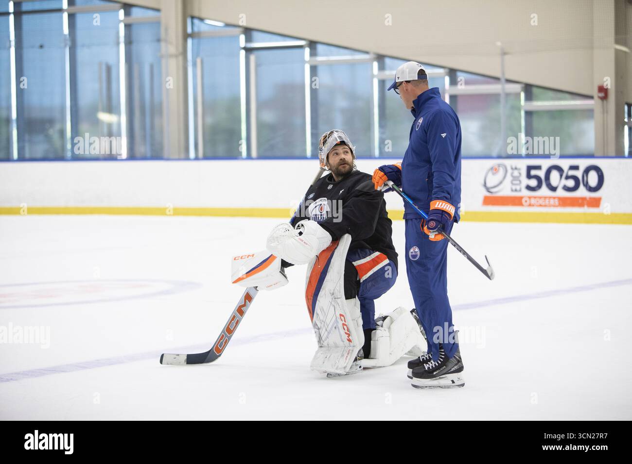 Edmonton Oilers goalie Stuart Skinner (74) talks with a coach during ...