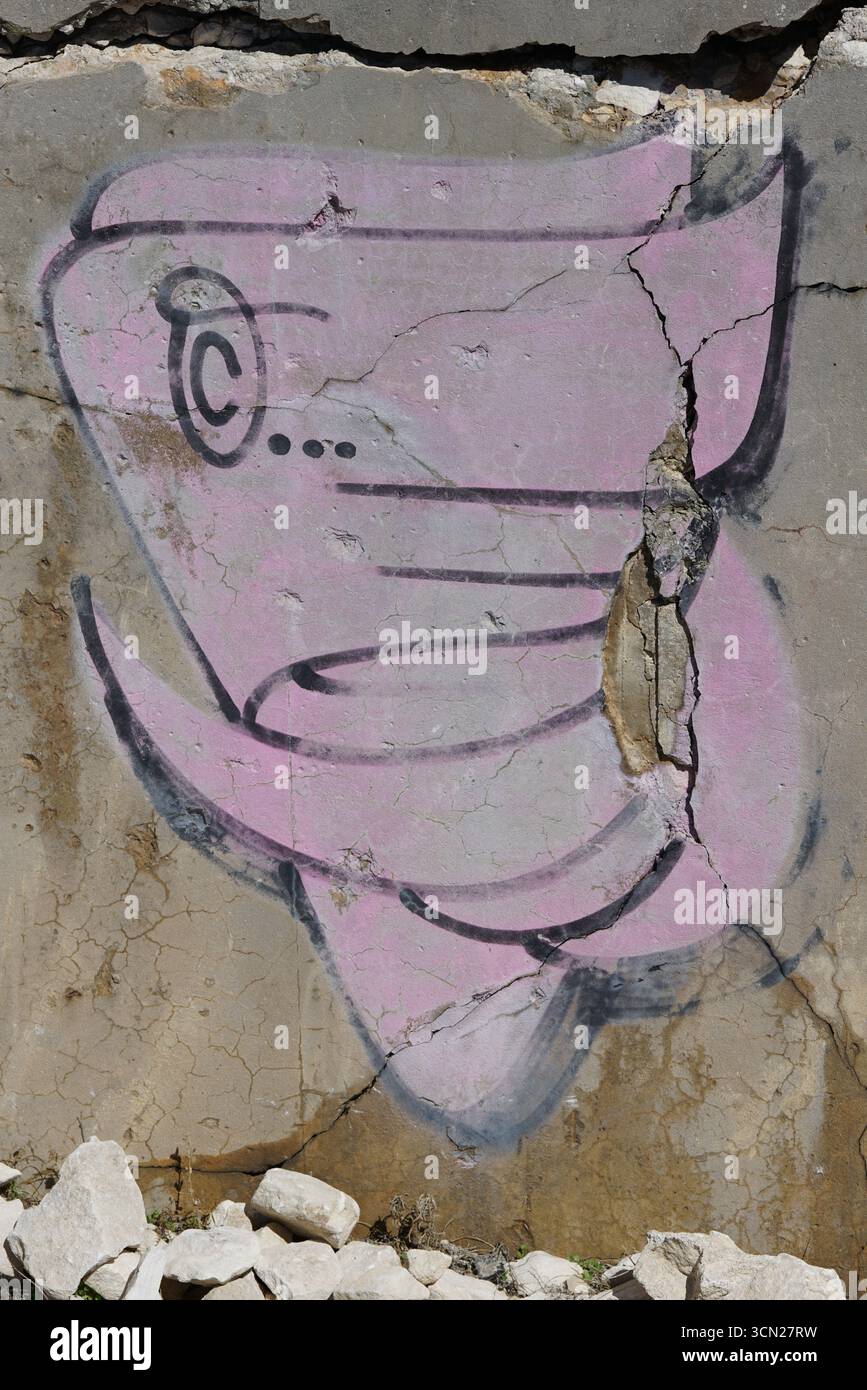 Pink Graffiti Face Mask on Cracked Wall — Urban Street Art Portrait in ...