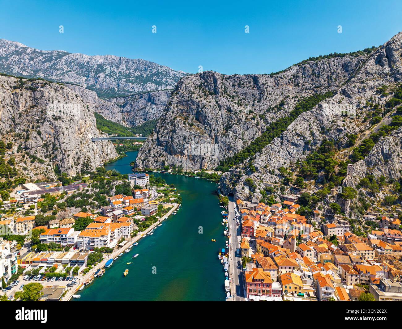 Omis Croatia river canyon with stone cliffs terracotta rooftops and ...