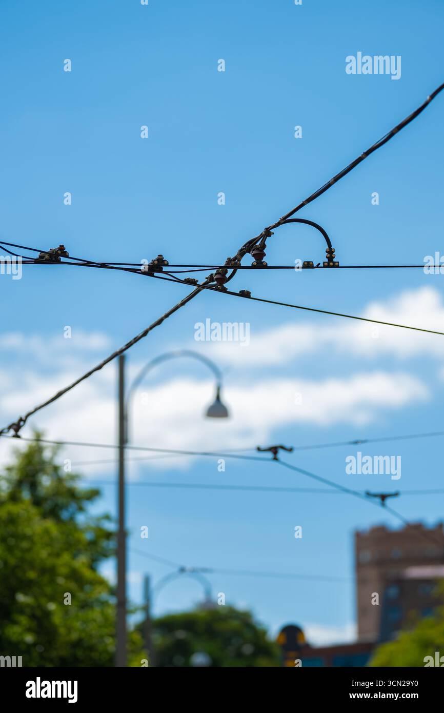 Tram power lines hanging in the sky Stock Photo - Alamy