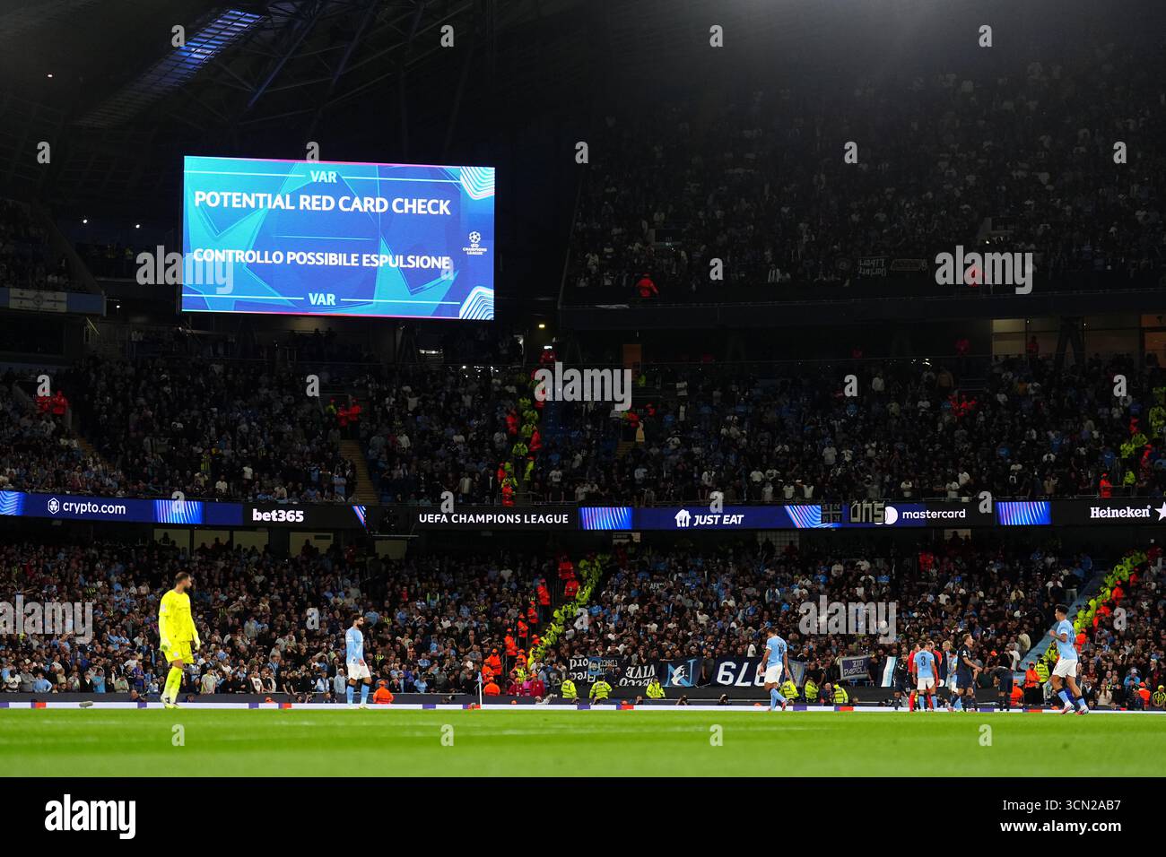 A general view as a VAR check takes place for a possible red card for ...