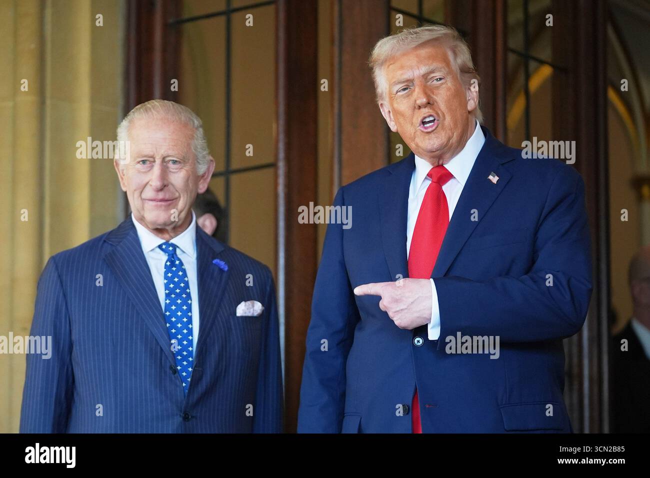 President Donald Trump gestures next to Britain's King Charles III ...