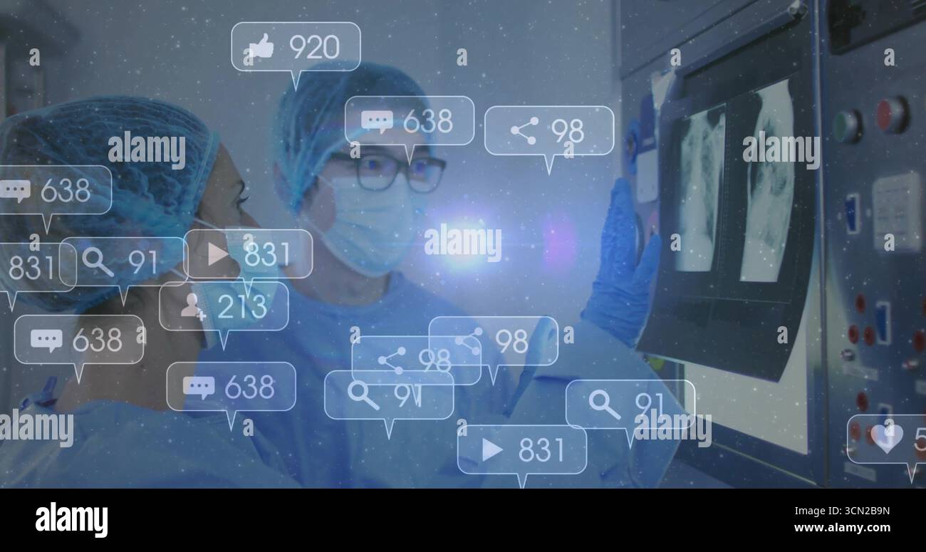 Reviewing scans surgeons wearing blue gowns standing in radiology room ...