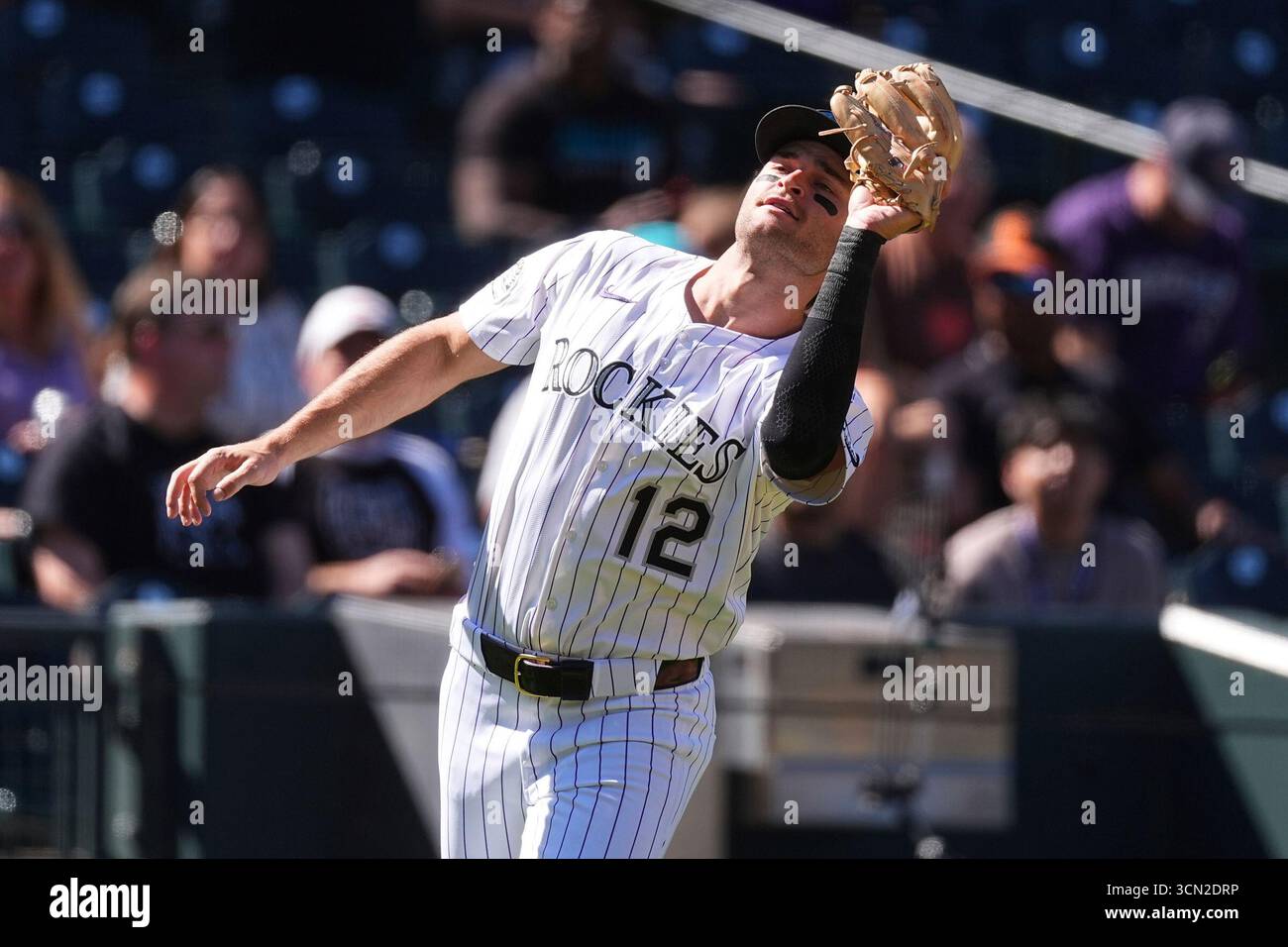 Colorado Rockies third baseman Kyle Karros pulls in a pop fly off the ...