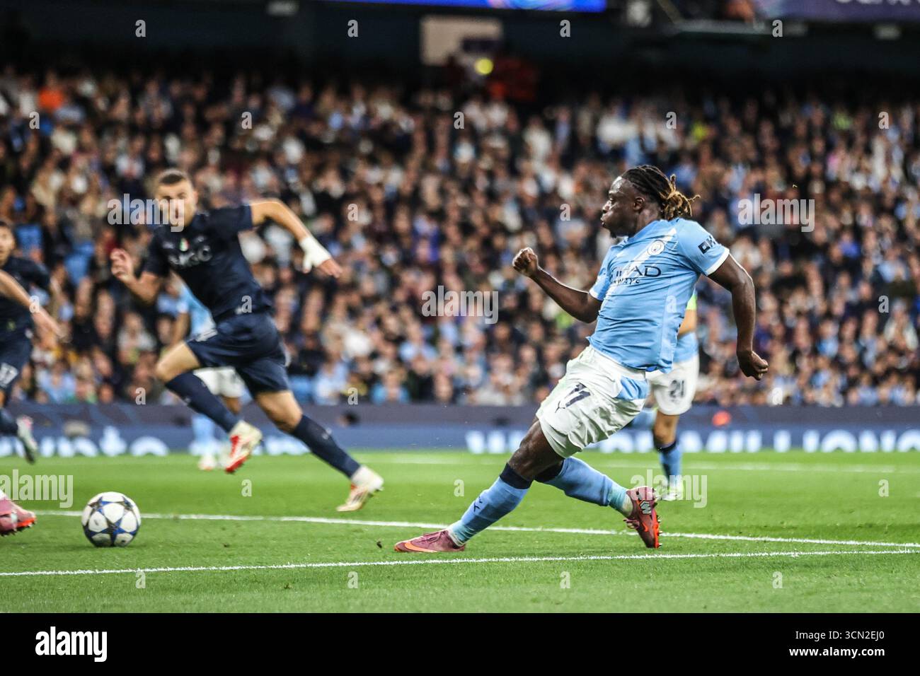 Jeremy Doku of Manchester City scores to make it 2-0 during the UEFA ...