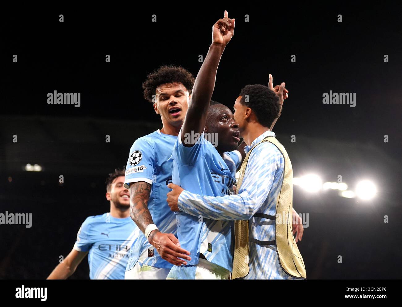 Manchester City's Jeremy Doku (centre) celebrates scoring their side's ...