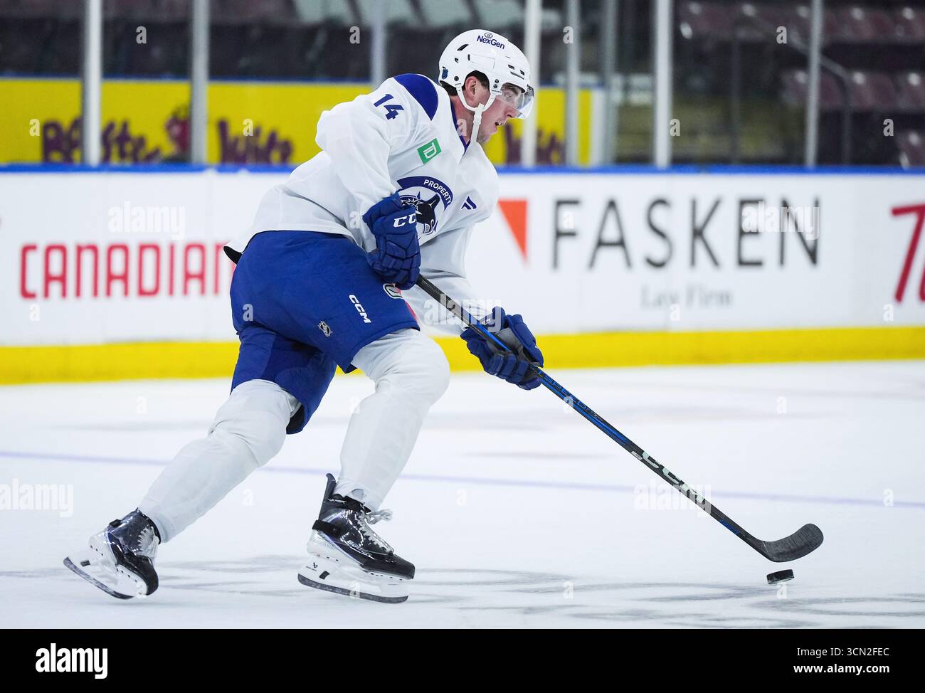 Vancouver Canucks' Joseph LaBate skates during opening day of the NHL ...