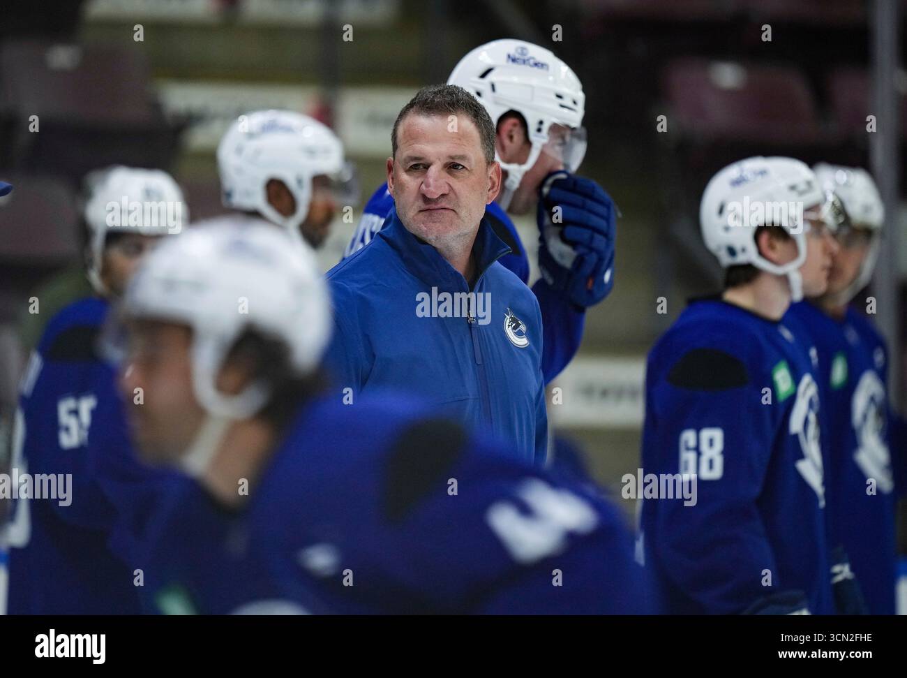 Vancouver Canucks head coach Adam Foote looks on during opening day of ...