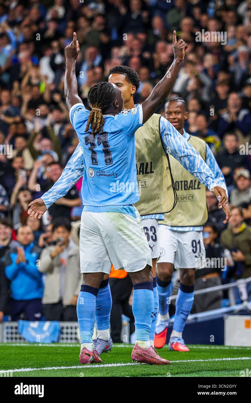Manchester City midfielder Jeremy Doku (11) scores a GOAL 2-0 and ...