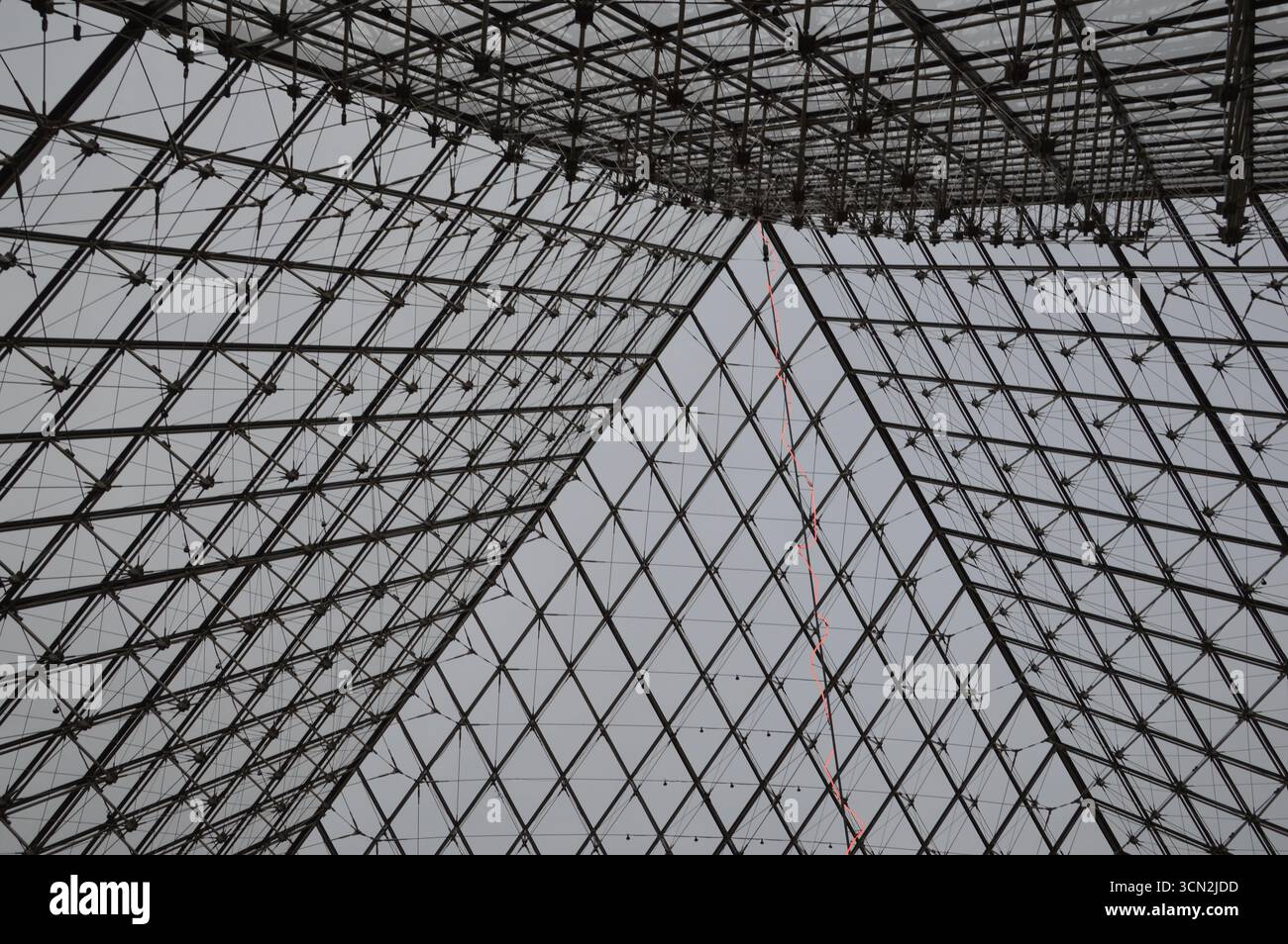 Interior view of the Louvre Pyramid glass structure, iconic ...