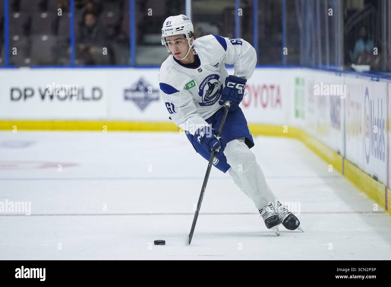 Vancouver Canucks' Chase Stillman skates with the puck during opening ...