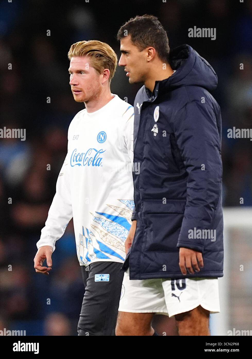 Napoli's Kevin De Bruyne (left) with Manchester City's Rodri after the ...