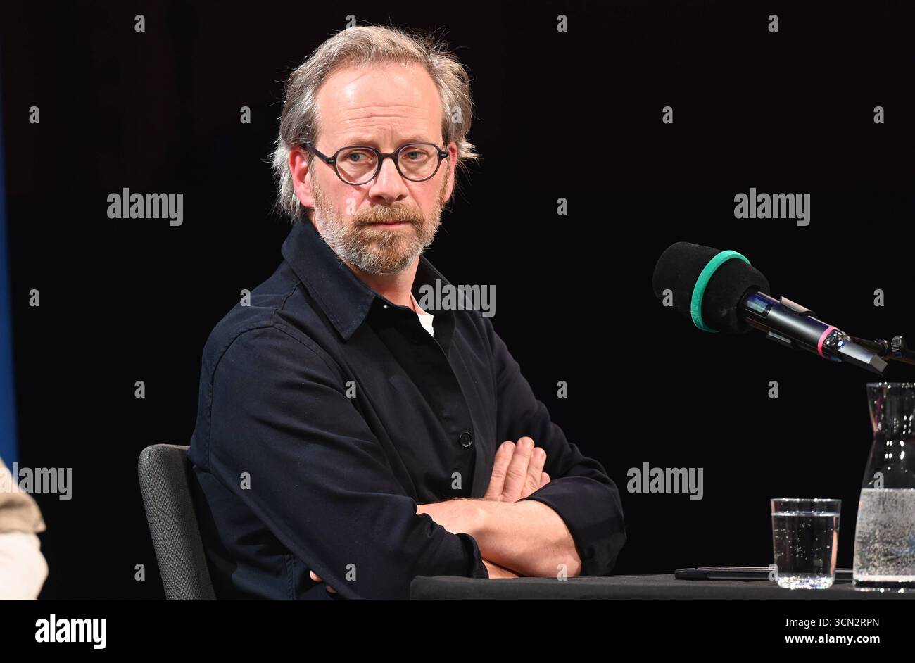 Schauspieler Fabian Busch auf der Bühne auf der Lit.Cologne, das ...
